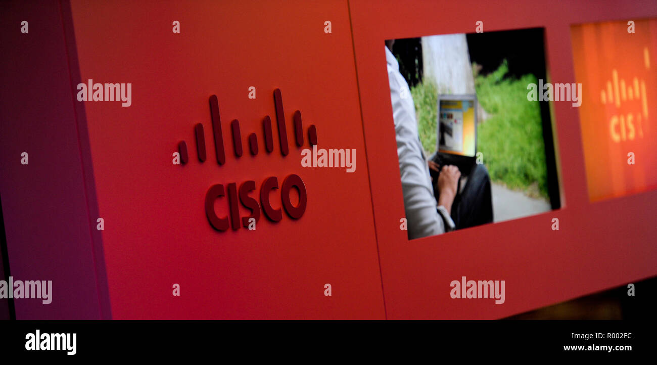 Cisco logo on wall with monitor screen showing a laptop in use Stock ...