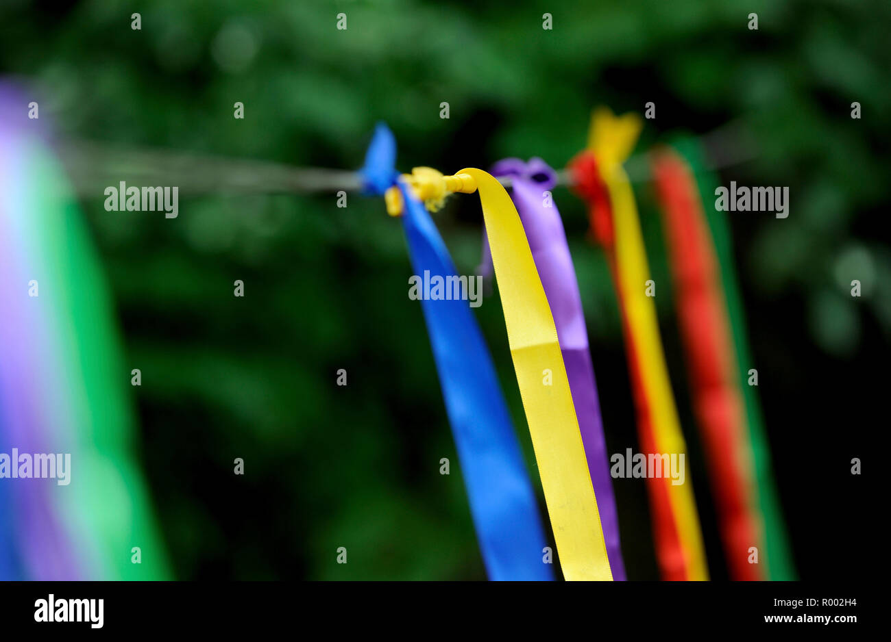 Coloured ribbons hanging on a washing line Stock Photo - Alamy