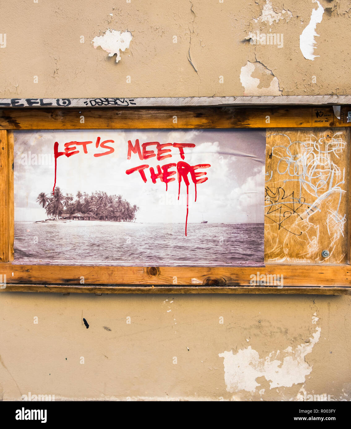 black and white photograph of a tropical island and the inscript "let´s ...