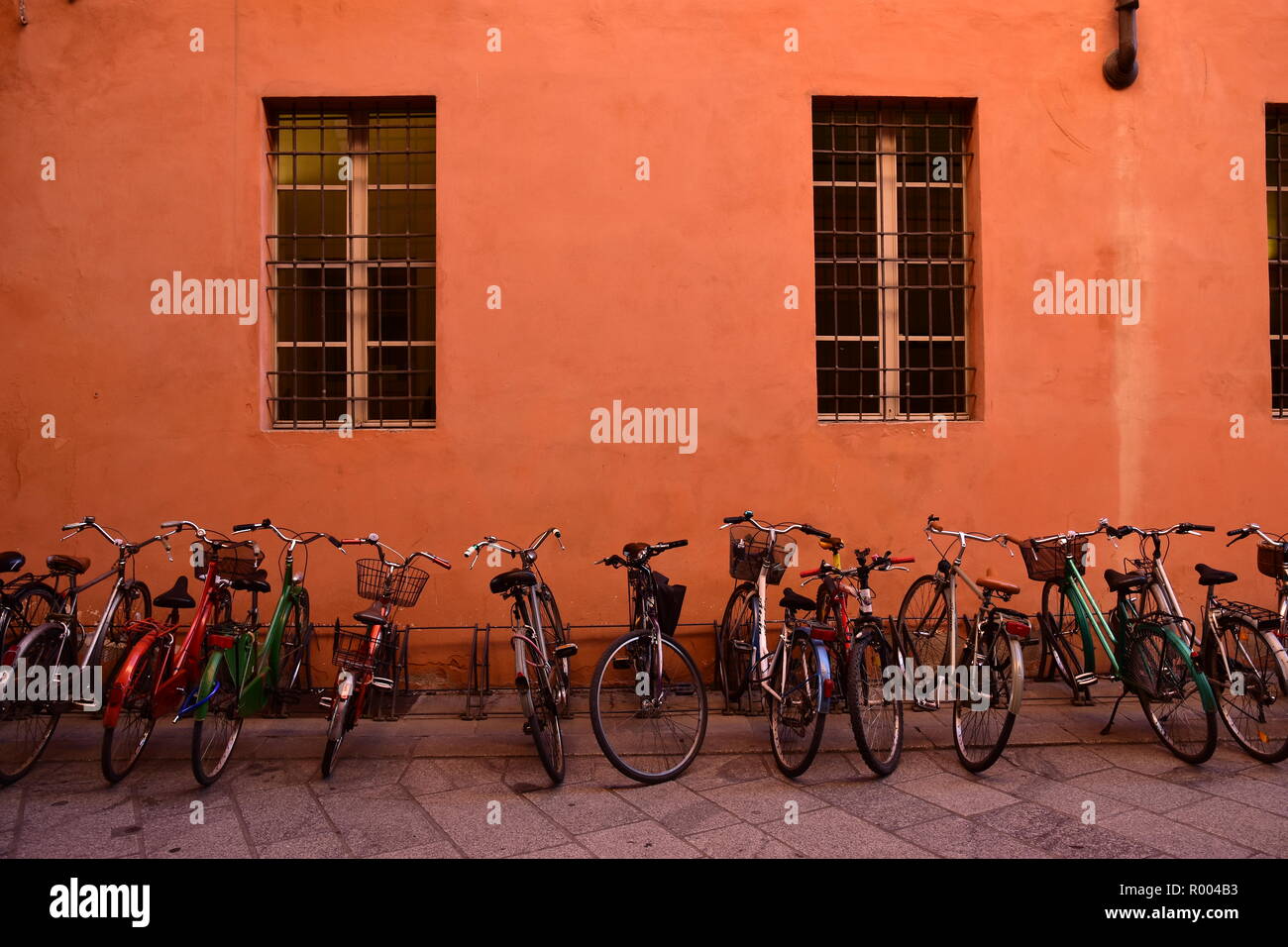 Bicycles in rack, Reggio Emilia, Italy Stock Photo - Alamy