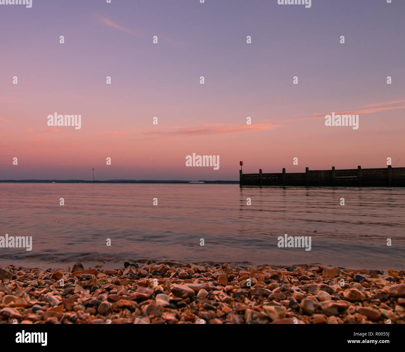 Calm seas at sunset hi-res stock photography and images - Alamy