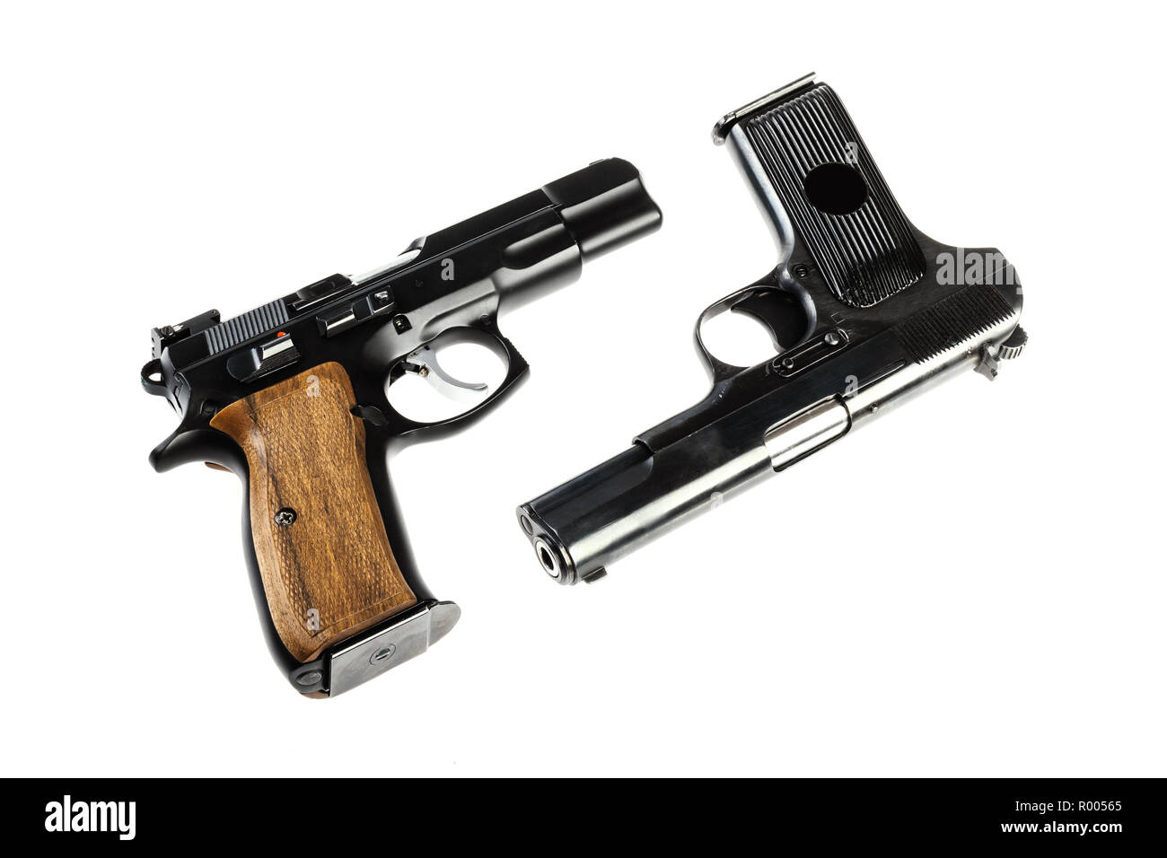 two isolated used black pistols on a white background Stock Photo - Alamy