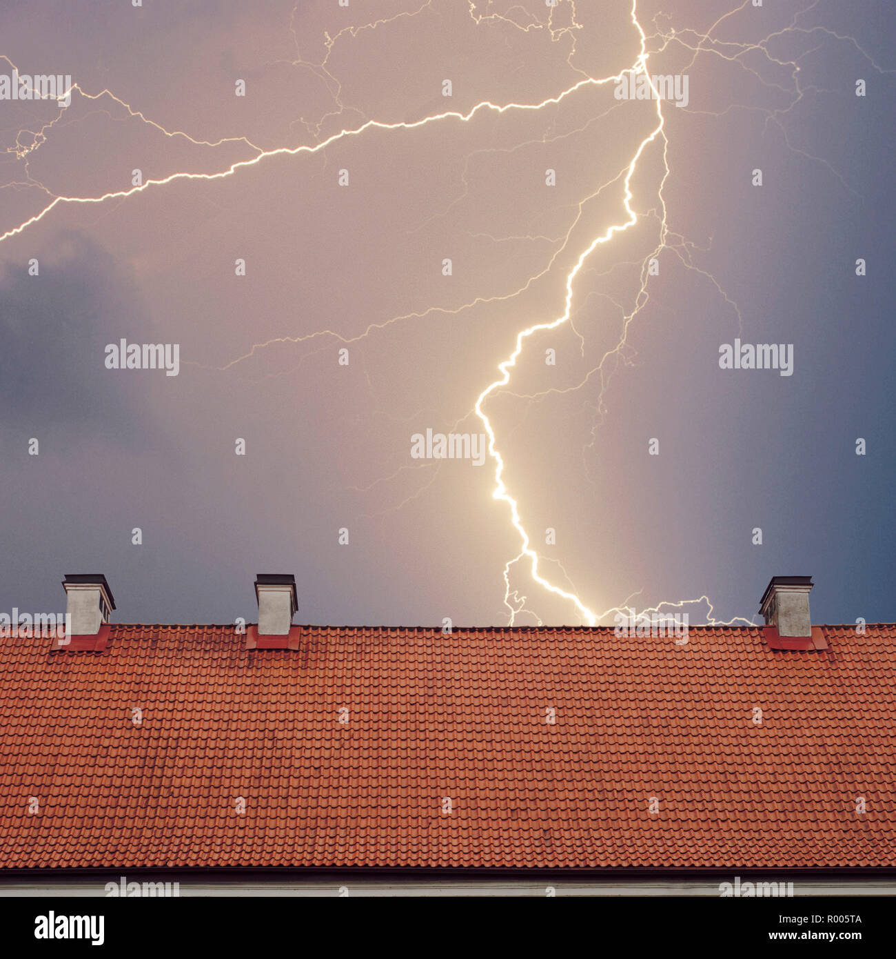 Thunderstorm with lightening over the roof at night Stock Photo - Alamy