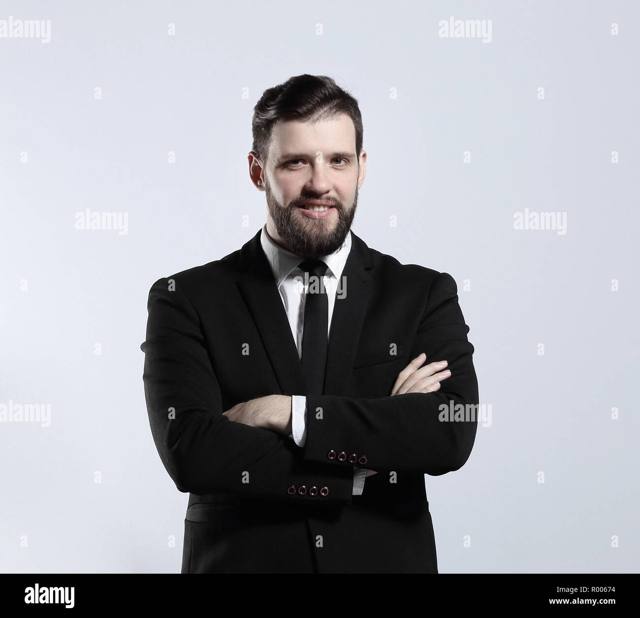 in full growth.portrait of a successful businessman.isolated on grey ...