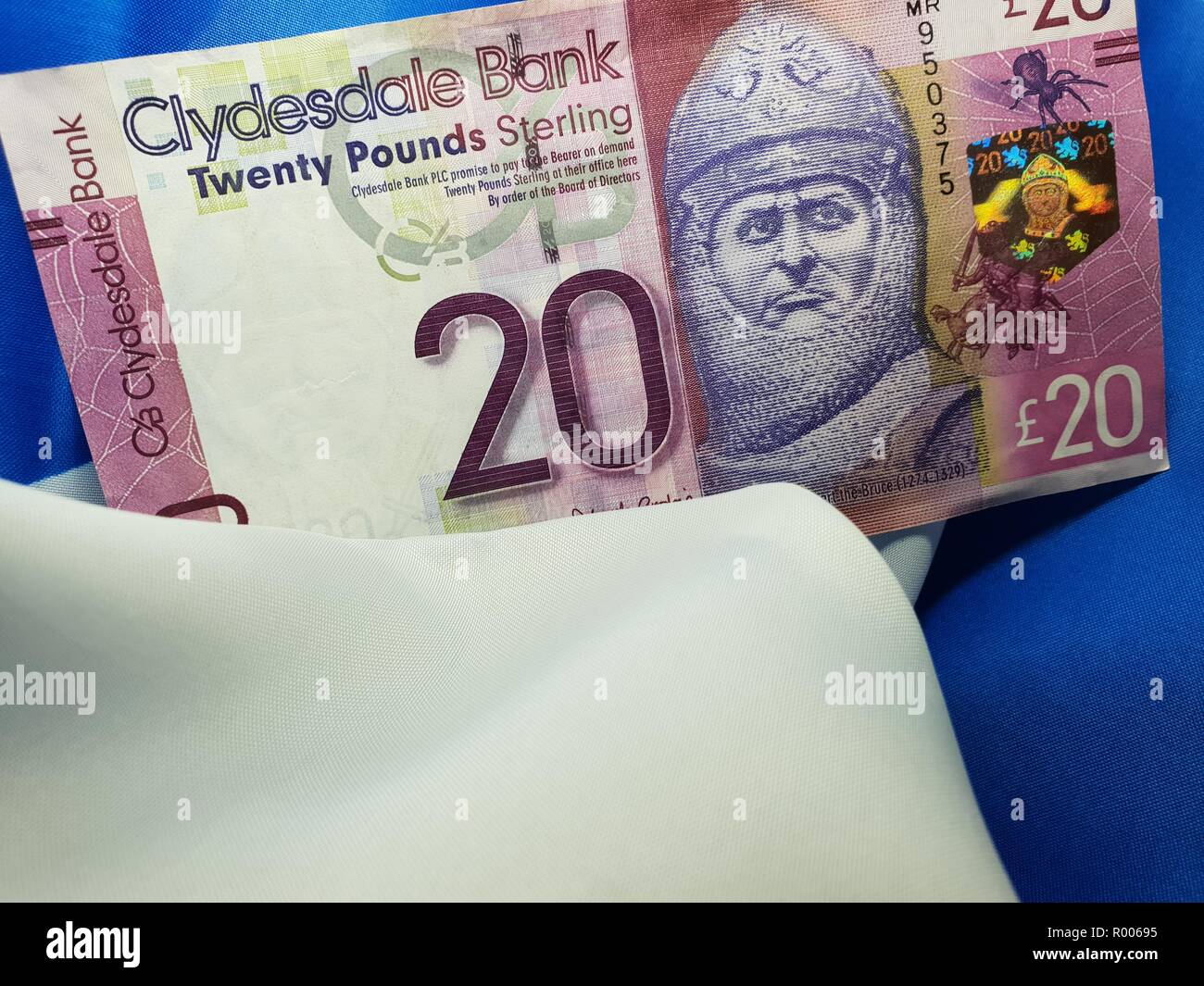 Scottish £20 banknote against Scottish flag Stock Photo - Alamy