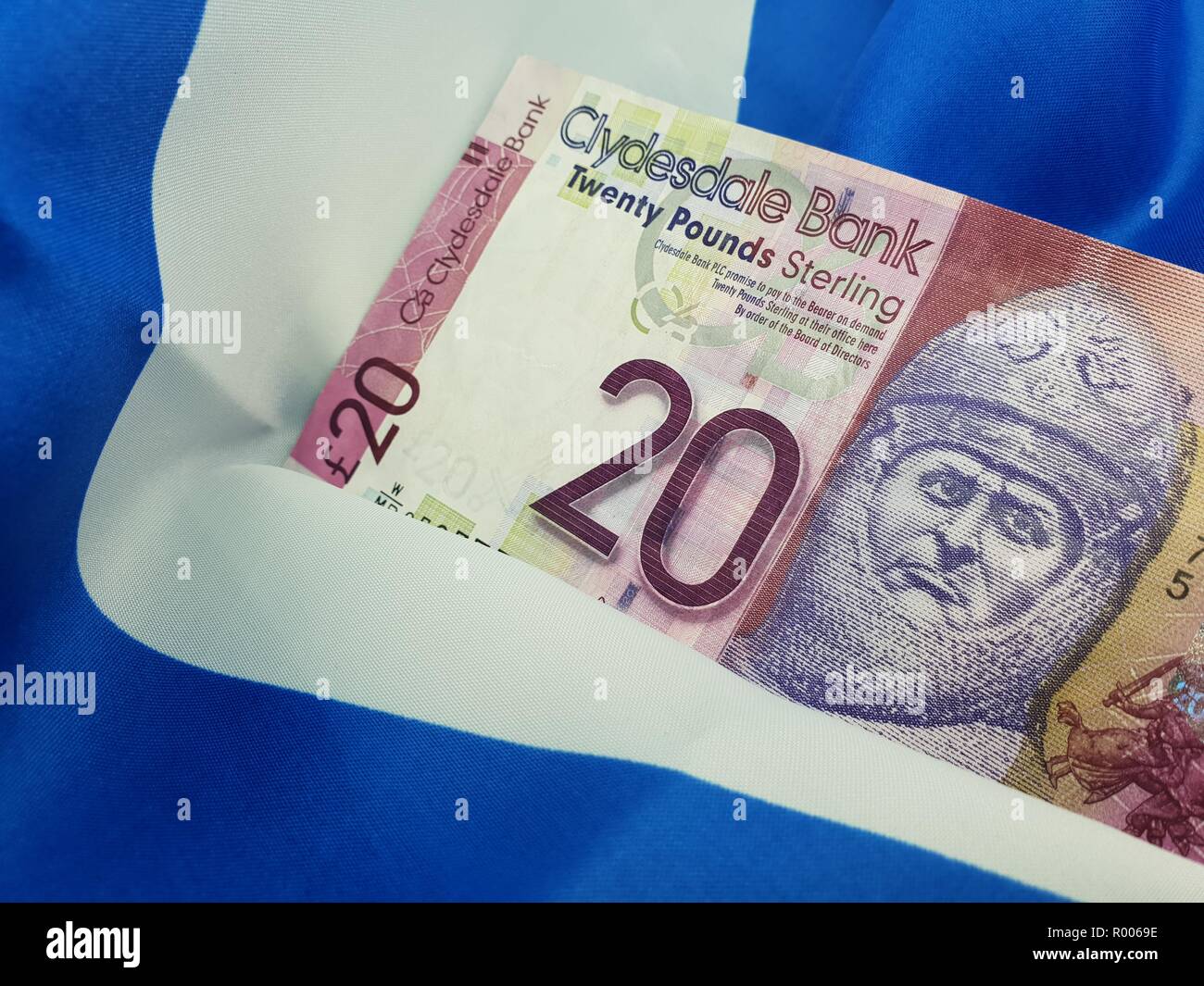 Scottish £20 banknote against Scottish flag Stock Photo - Alamy