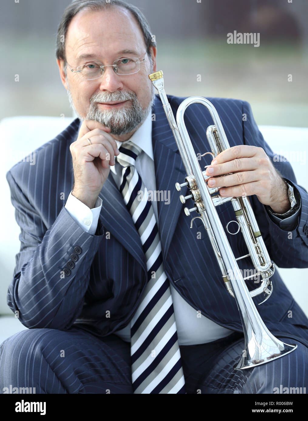 portrait of adult male musician with a trumpet Stock Photo - Alamy