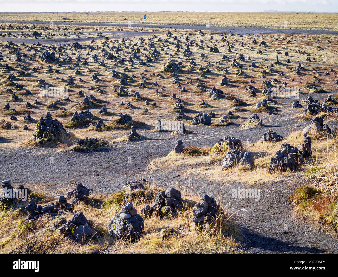Laufskalavarda -- a lava ridge, surrounded by stone cairns in South ...