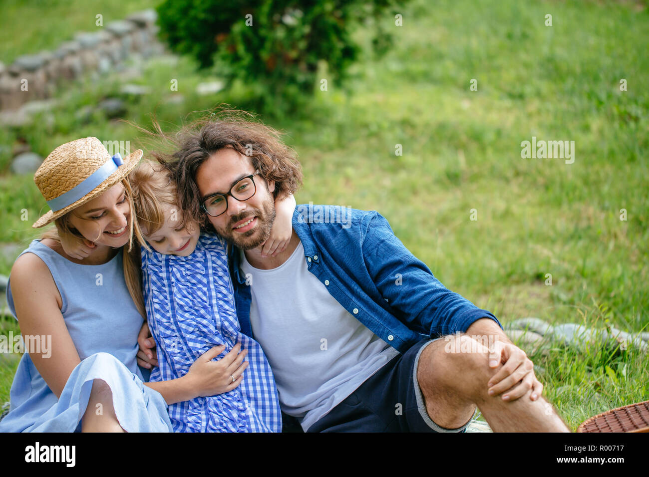 Family with child hugging and having fun outdoor Stock Photo - Alamy