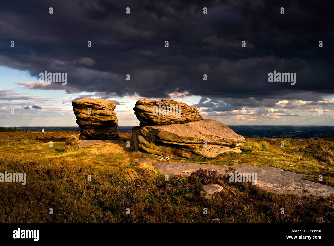 The Ox Stones caught in storm light. Burbage Moor, the Peak District ...