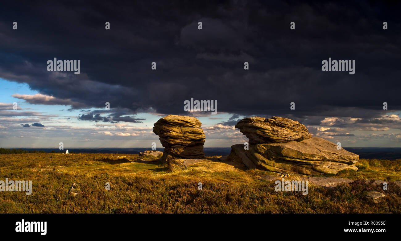 The Ox Stones caught in storm light. Burbage Moor, the Peak District ...