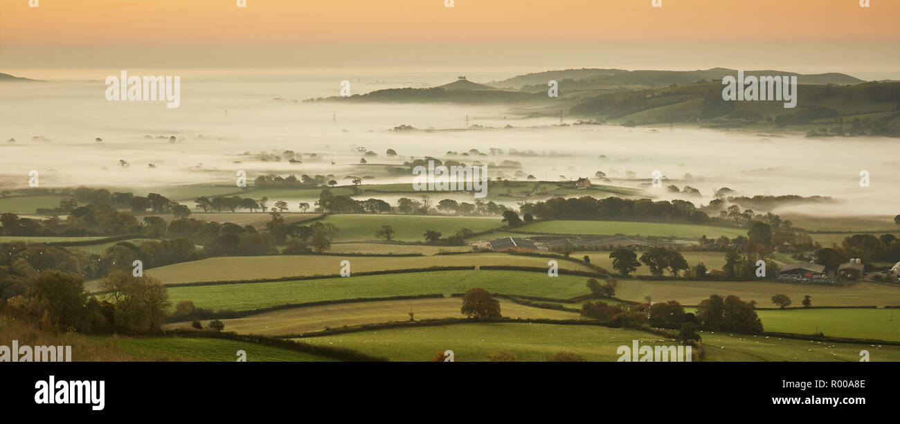 Looking down from the top of Pilsdon Pen hill in Dorset at farming land ...