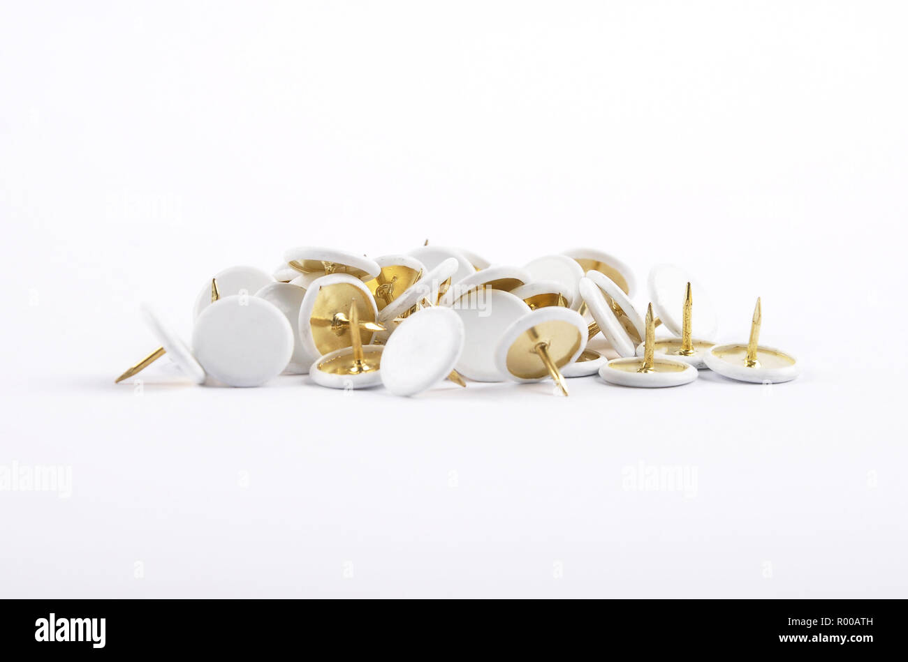 Drawing pins on white Stock Photo - Alamy