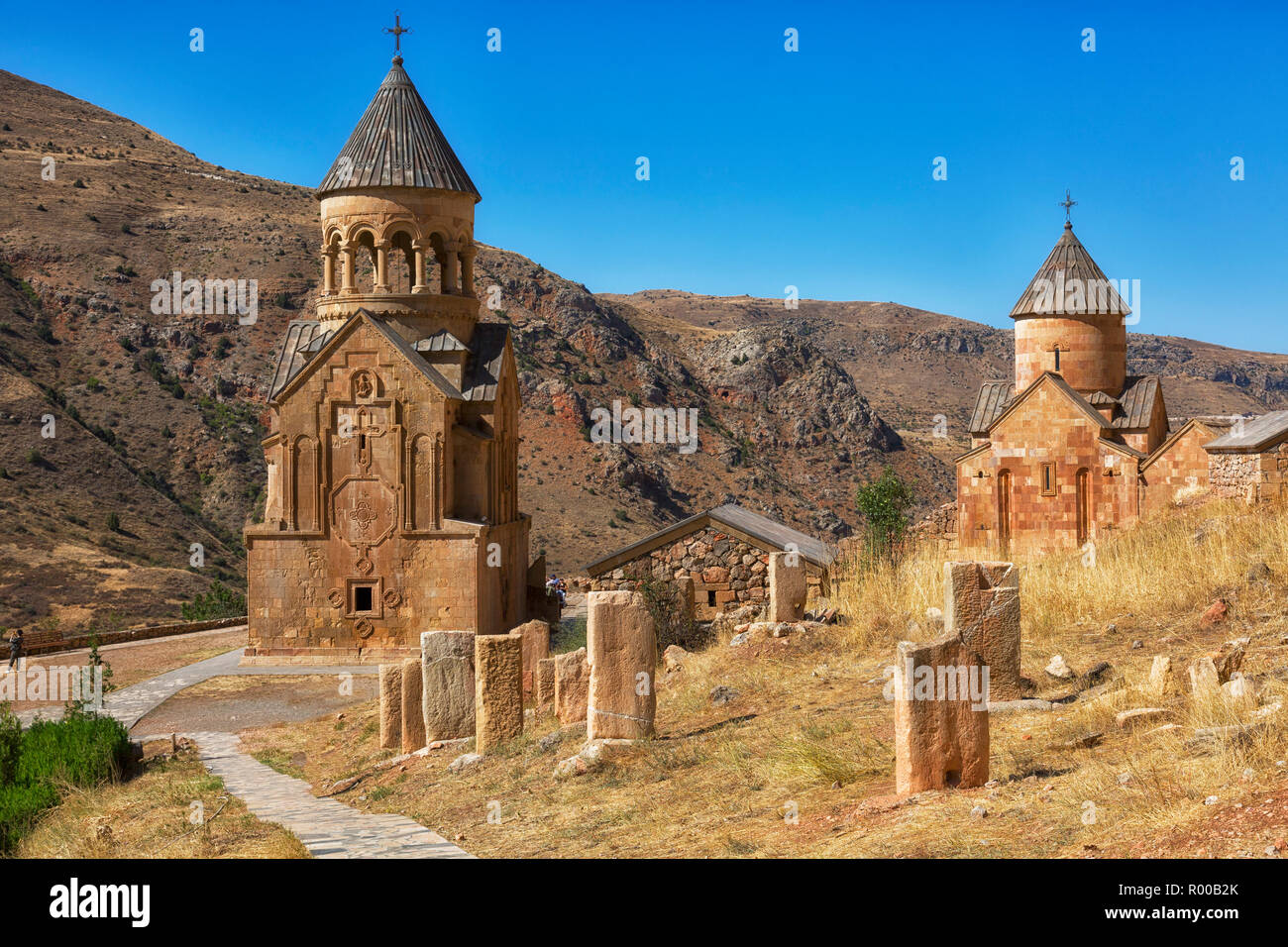 Noravank monastery complex built on ledge of narrow gorge. Tourist and ...