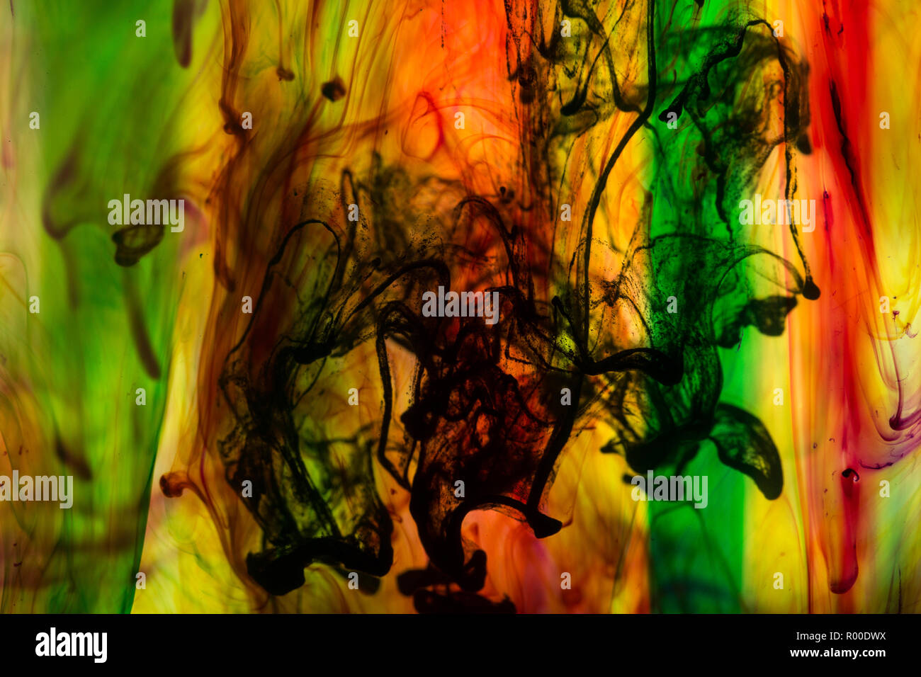 Acrylic colors and ink in water. Abstract background Stock Photo - Alamy