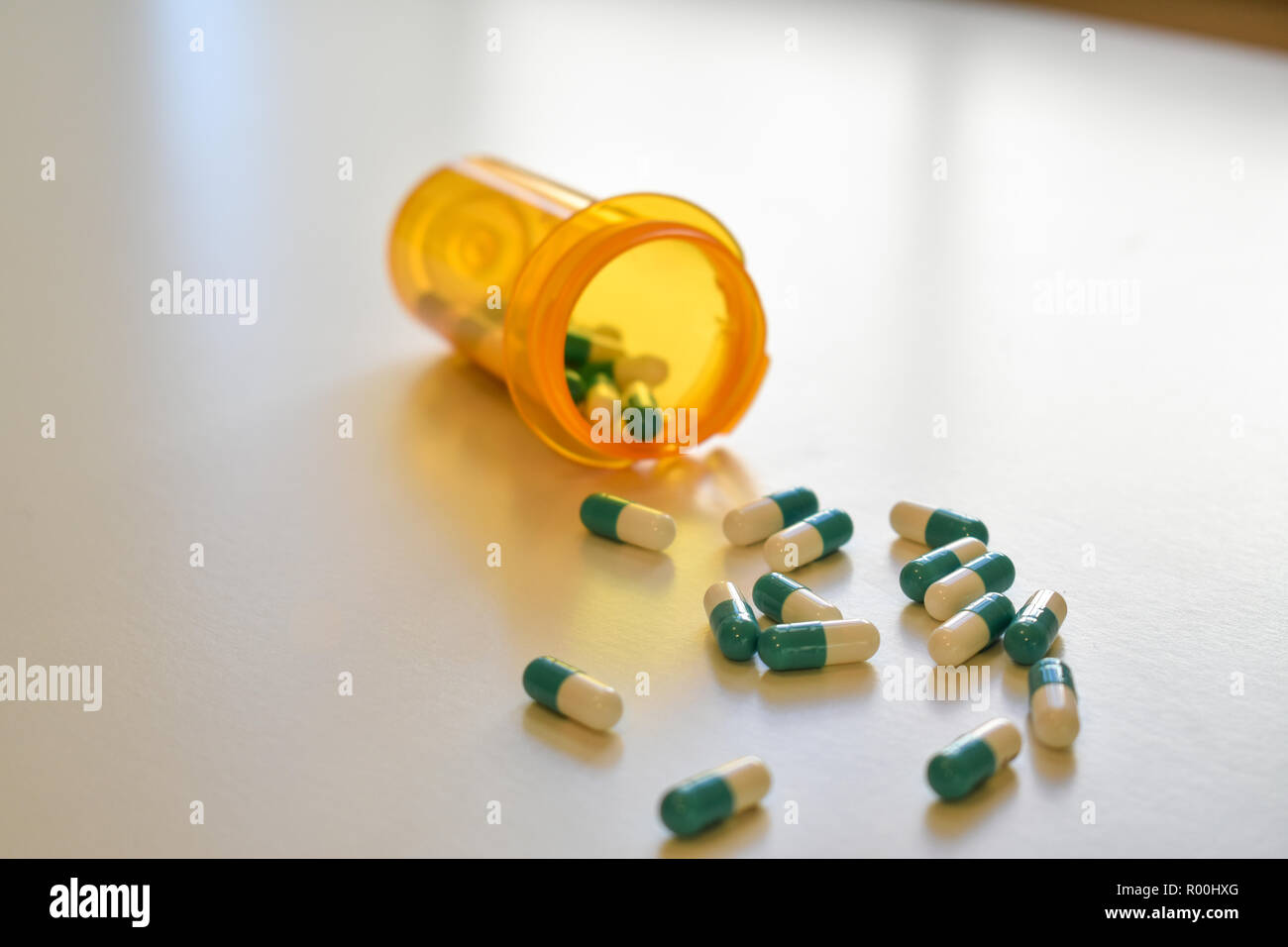 Pills spread on table with background Stock Photo - Alamy