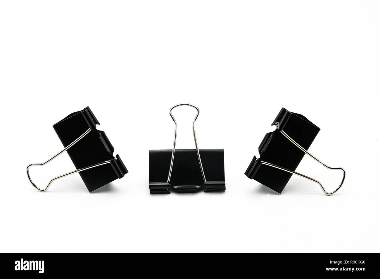 Binder clip device for tying paper sheets together Stock Photo - Alamy