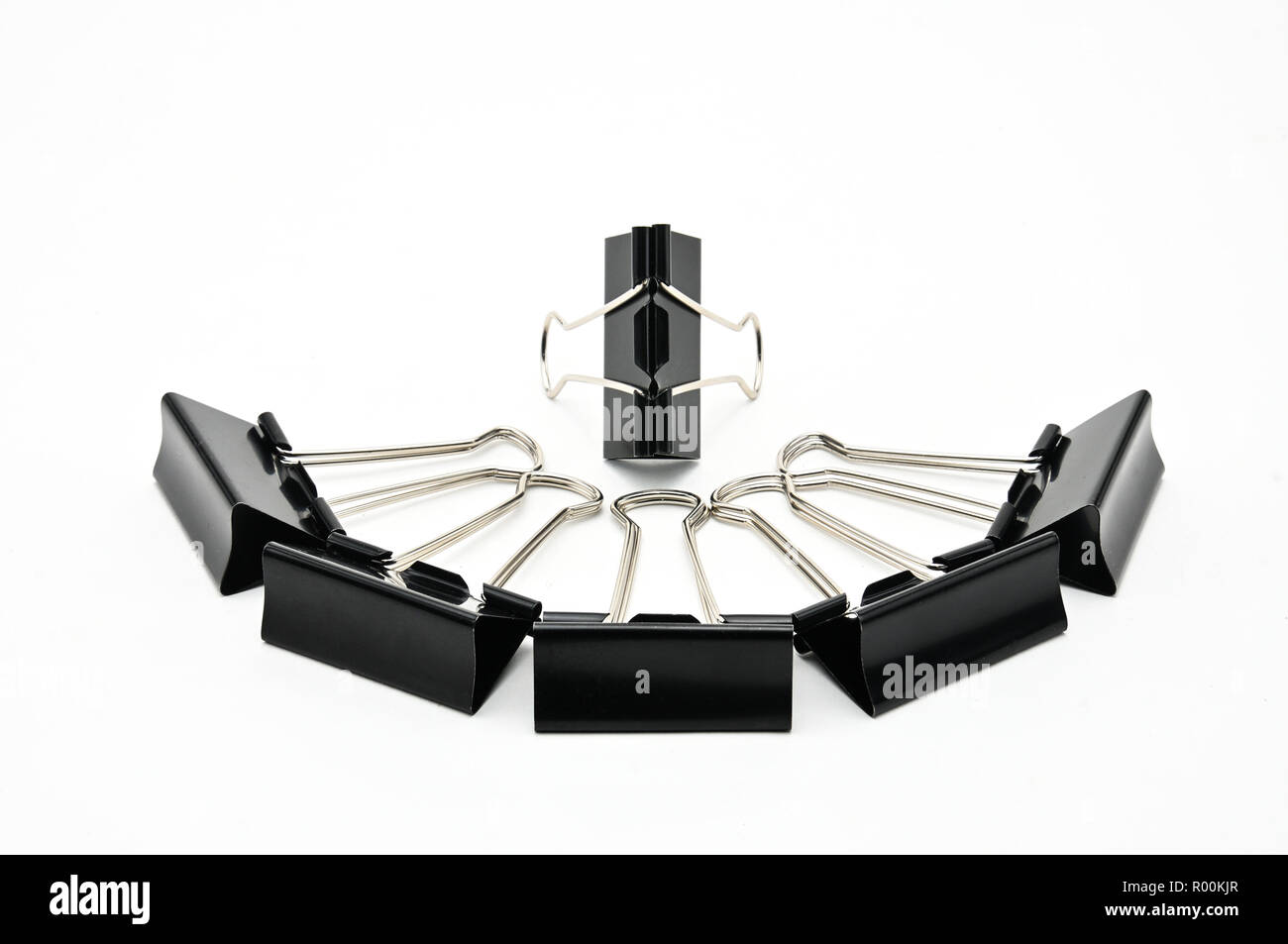 Binder clip device for tying paper sheets together Stock Photo - Alamy