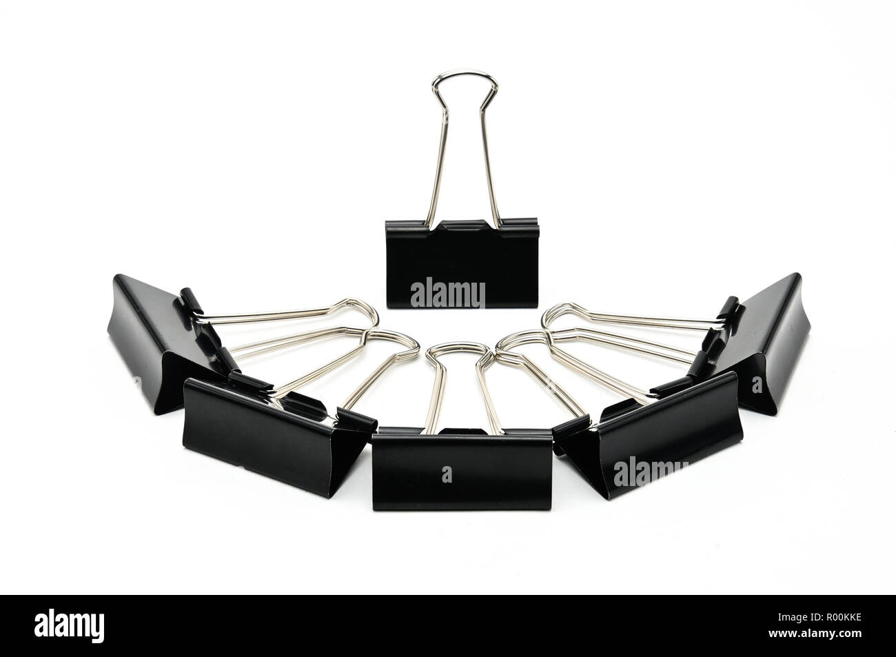 Binder clip device for tying paper sheets together Stock Photo - Alamy