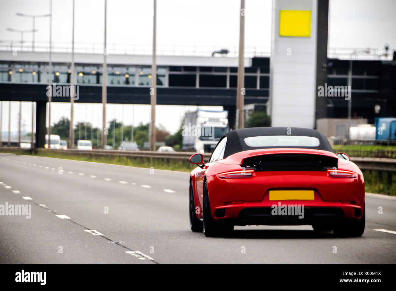 Red car on highway hi-res stock photography and images - Alamy