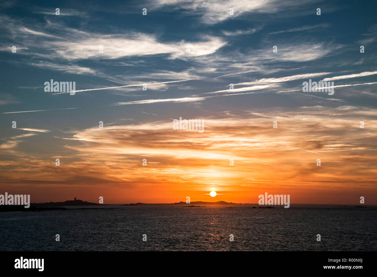 Sunset over Lihou Island, Guernsey Stock Photo - Alamy