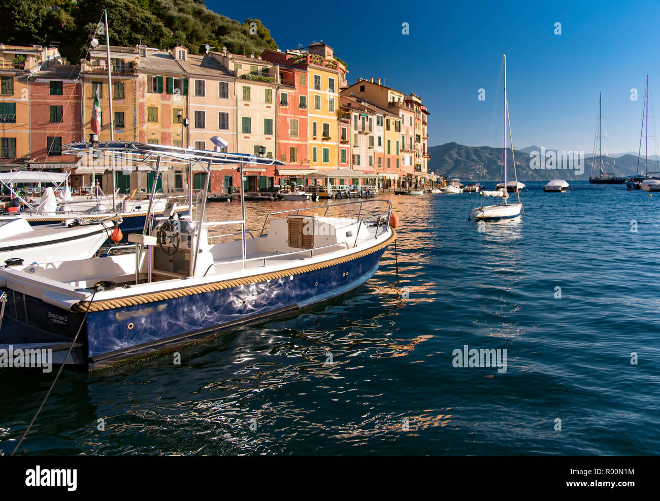 Boats moored in Portofino harbour, Italian Riviera, Italy on a sunny ...
