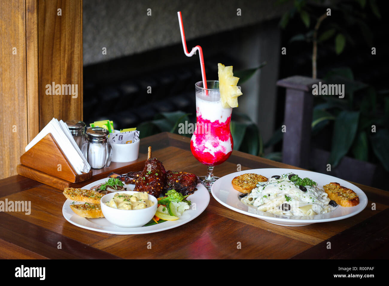 Milk shake and chicken lollipop Stock Photo - Alamy