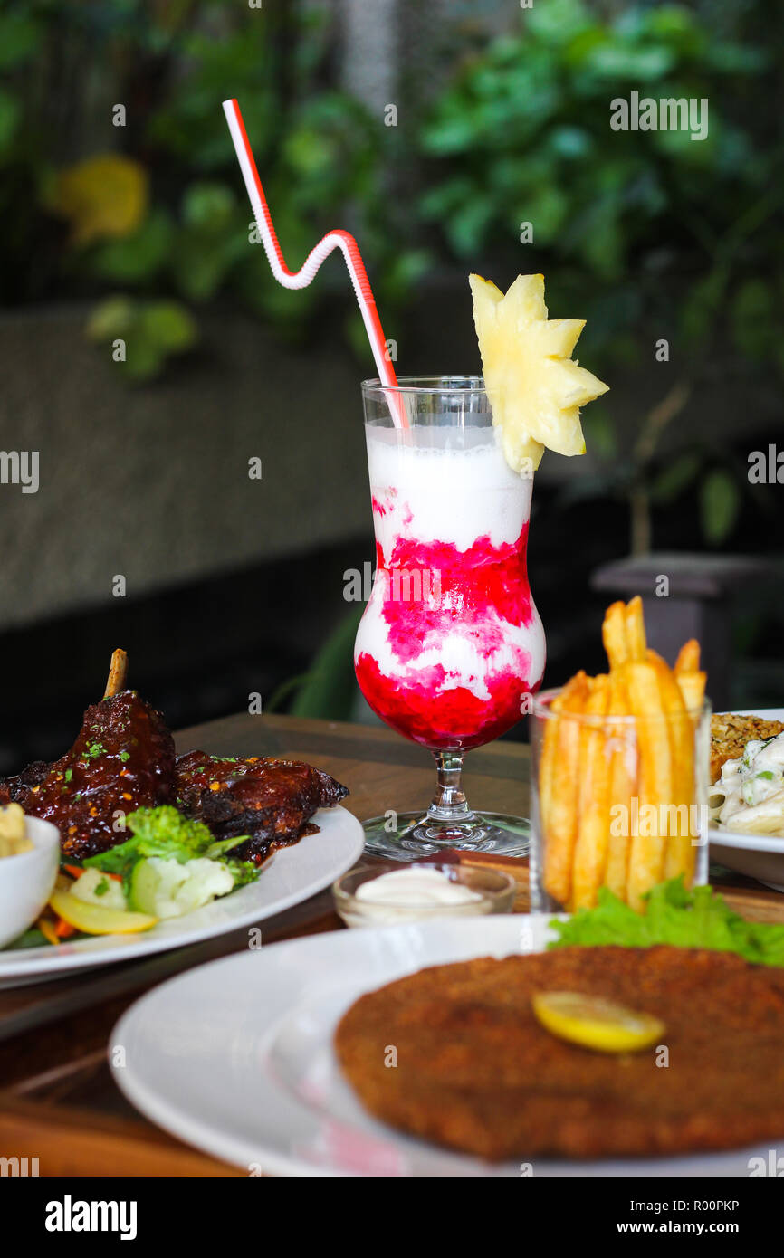 Milk shake and chicken lollipop Stock Photo - Alamy