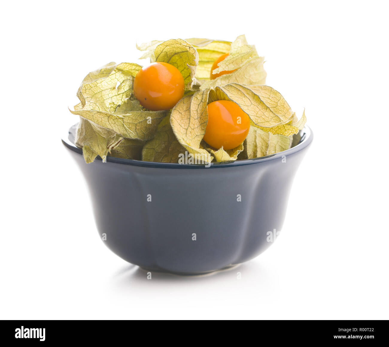Physalis peruviana fruit in bowl isolated on white background Stock ...