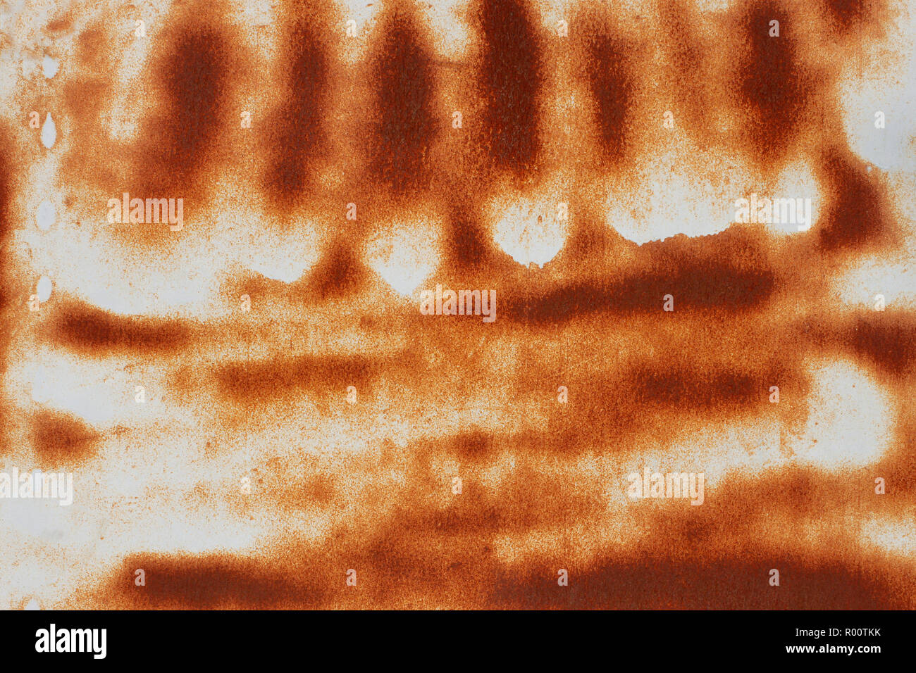 Rust is shown through a layer of paint on the metal flat surface Stock ...