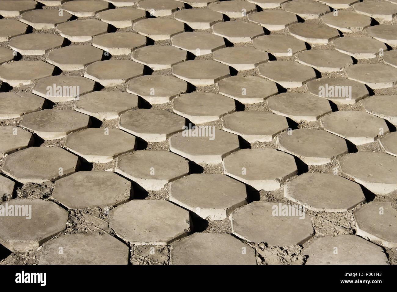 Consolidated skeleton with large octagonal concrete plates fastened ...