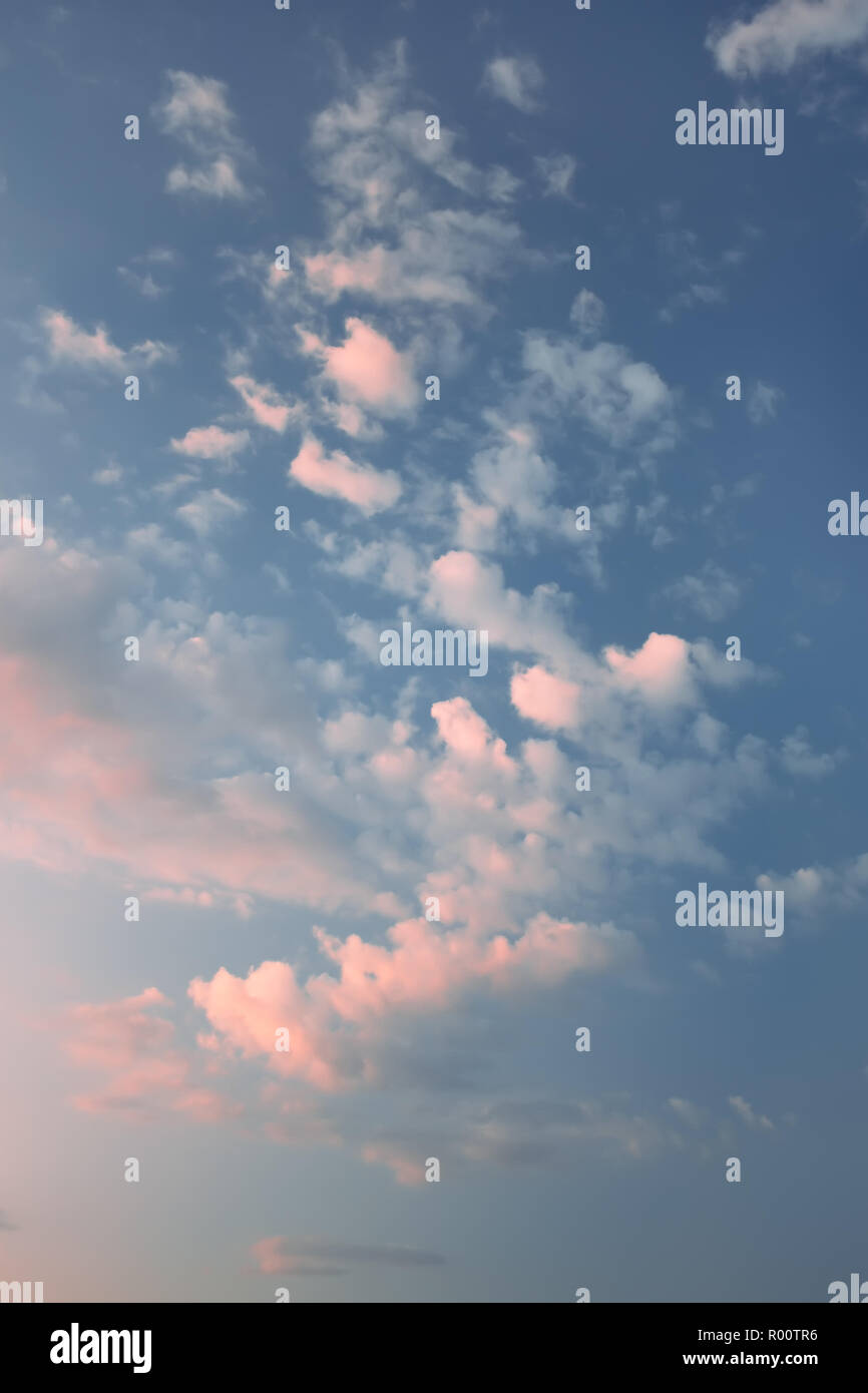 Many small clouds in the beams of setting sun Stock Photo - Alamy