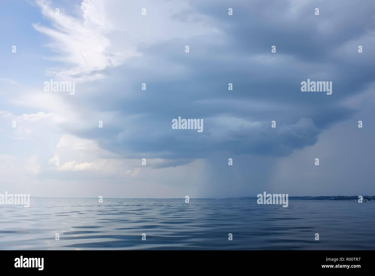 Rain zone on the coastal area of the sea Stock Photo - Alamy