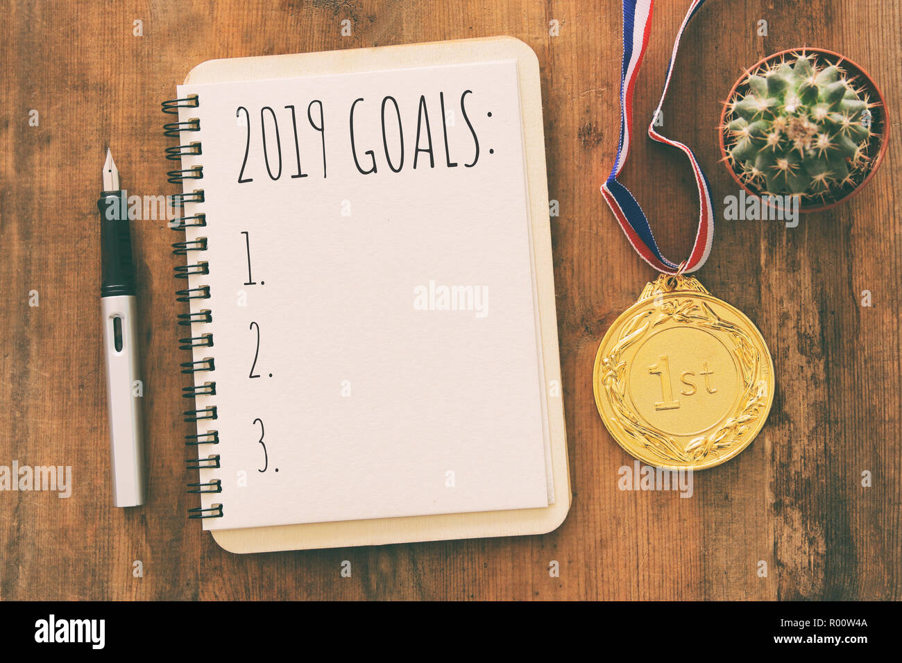 Top view 2019 goals list with notebook over wooden desk Stock Photo - Alamy