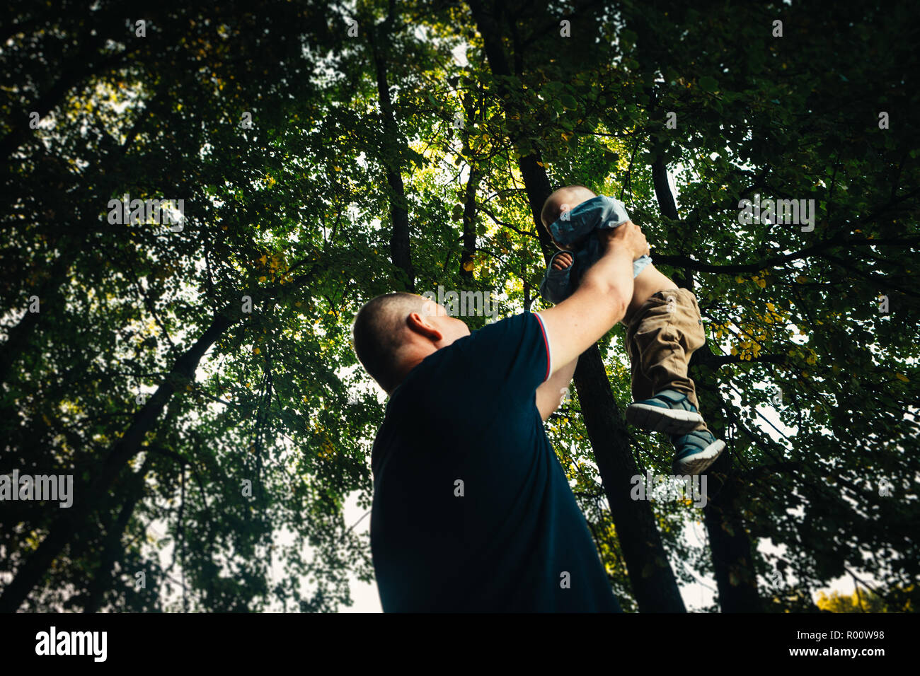happy dad and baby on nature background Stock Photo - Alamy