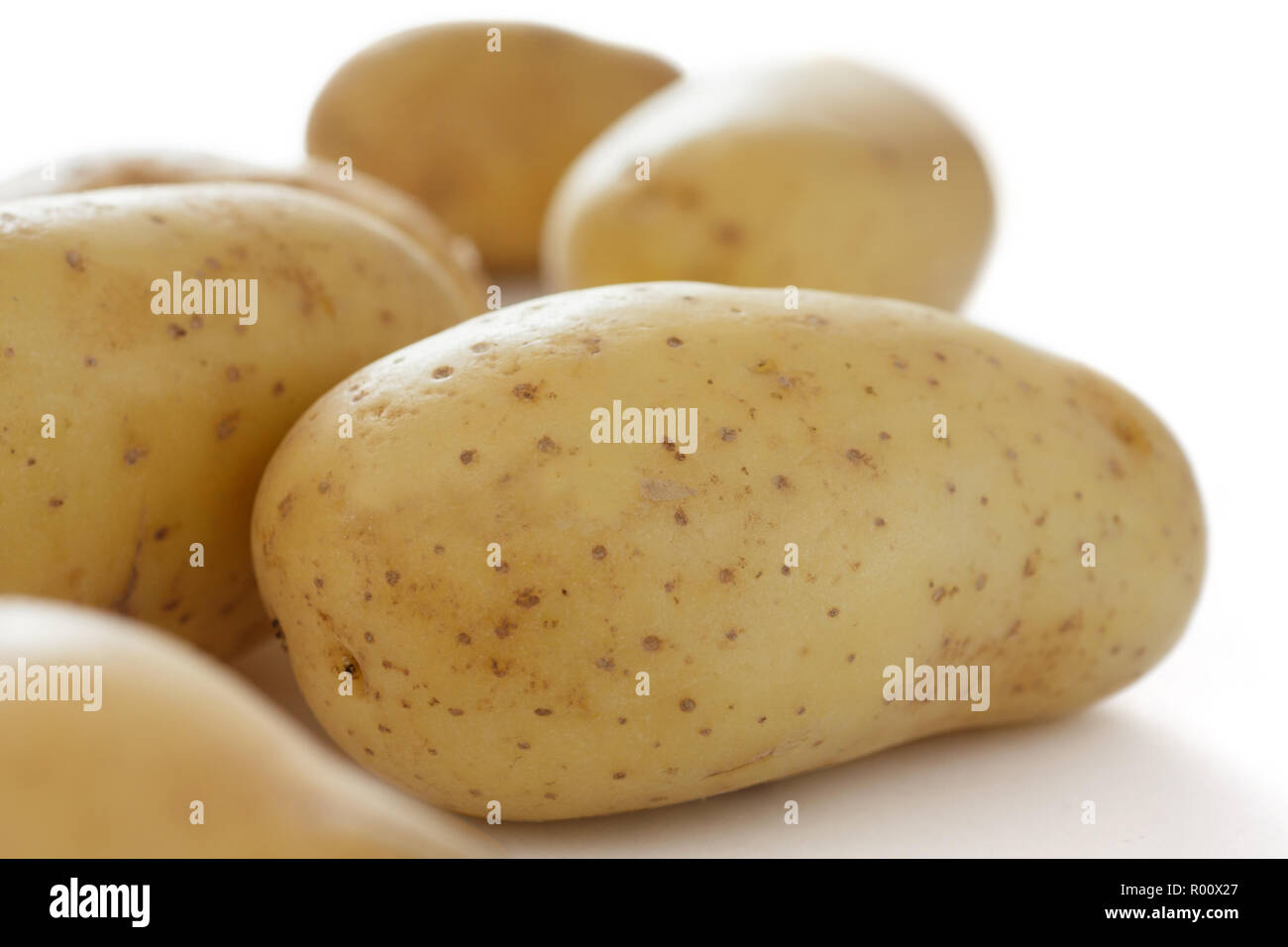 Group of washed potatoes with skins on white Stock Photo - Alamy