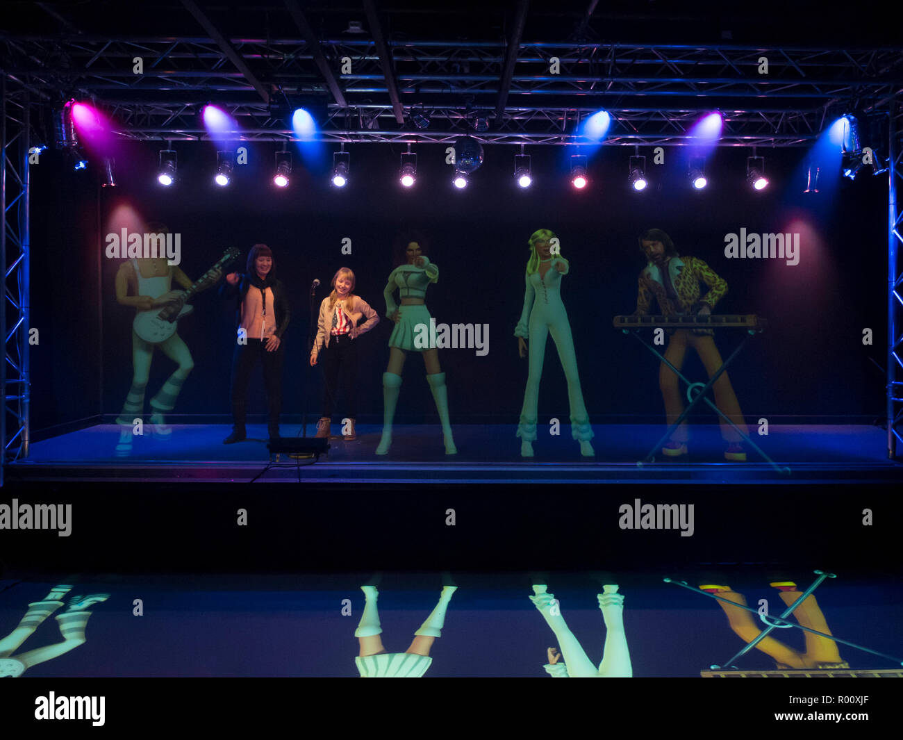 A kid joins the group to sing a song in a 3D, interactive performance ...