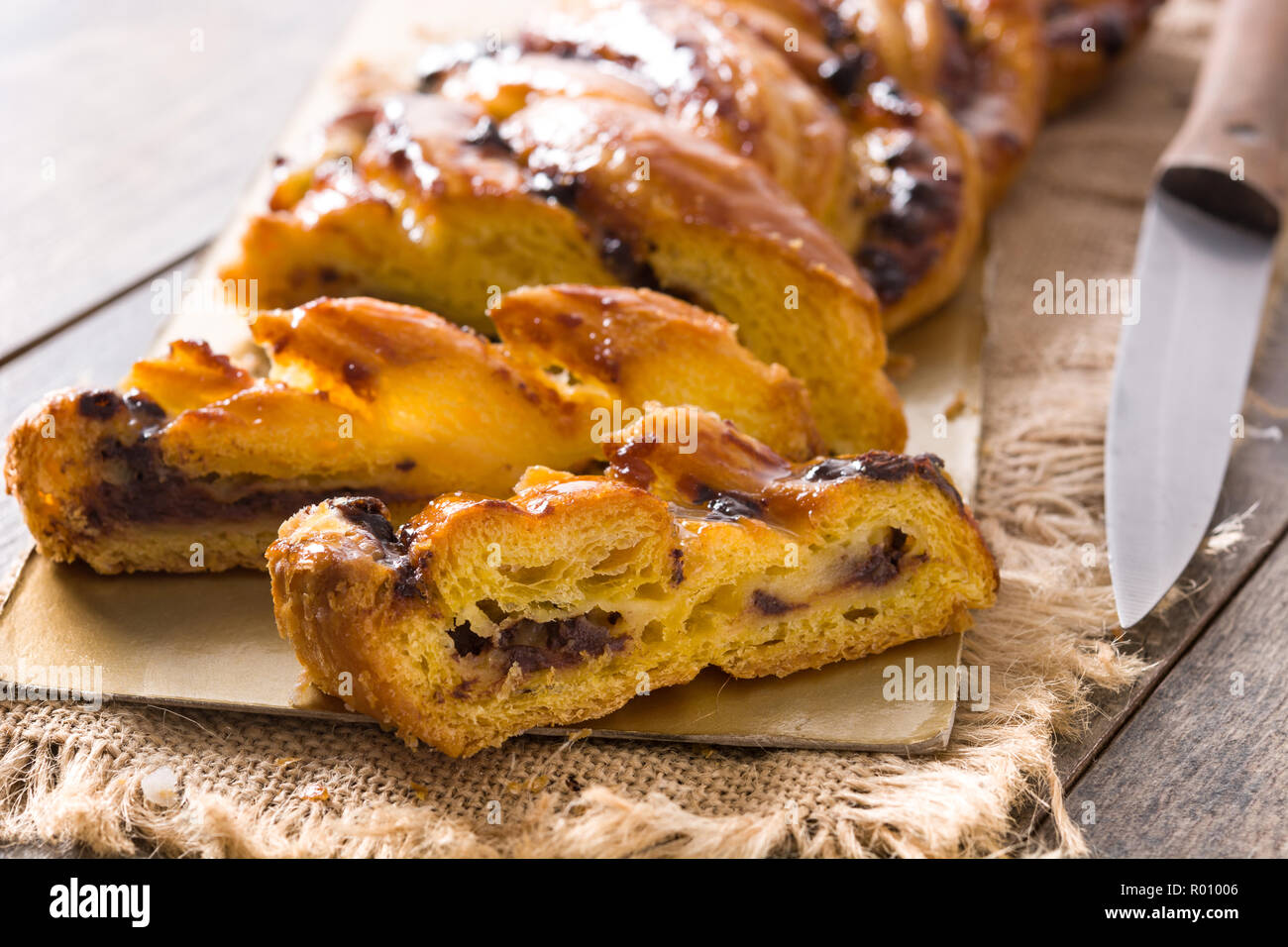 Homemade braid chocolate on wooden table. Close up Stock Photo - Alamy