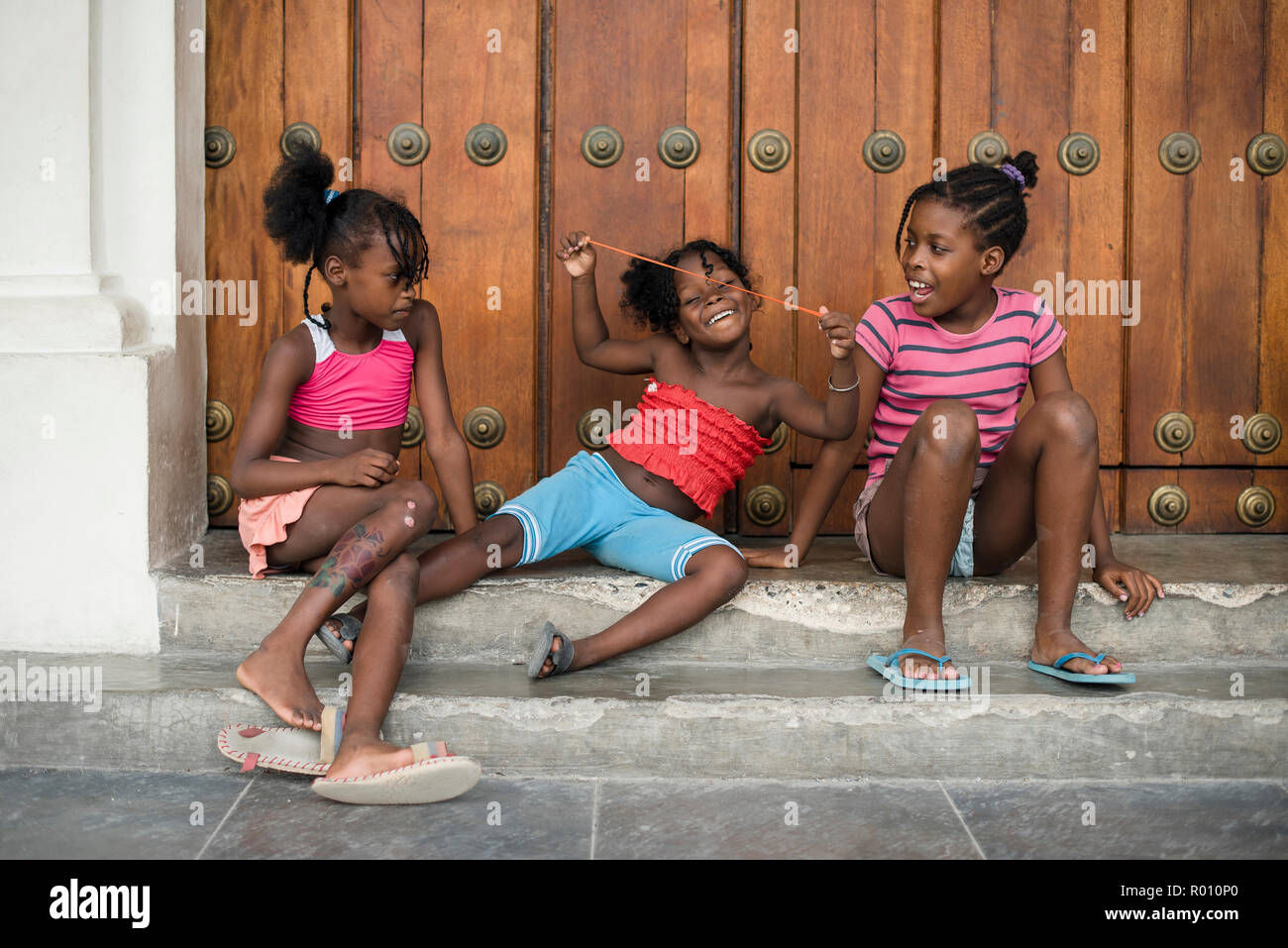 Some silly girls pose for the camera in a plaza in Havana, Cuba Stock ...