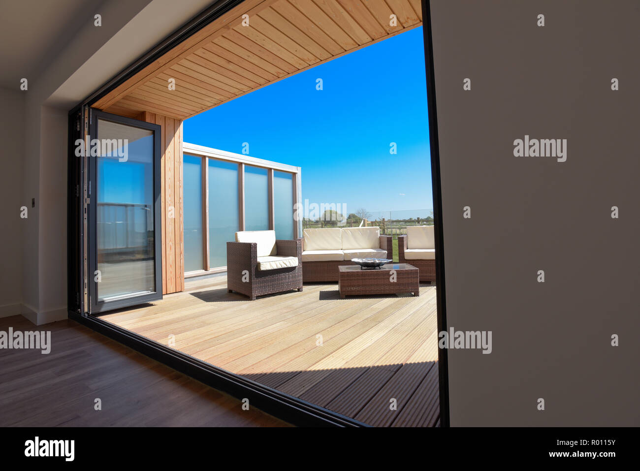 Open French window looking at a contemporary designed terrace Stock ...