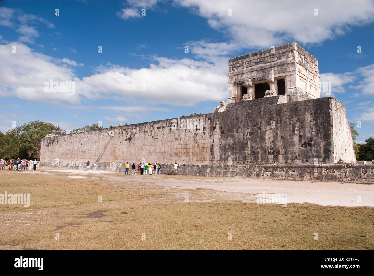 Tourists view the Great Ball Court (Gran Juego de Pelota), used to play ...