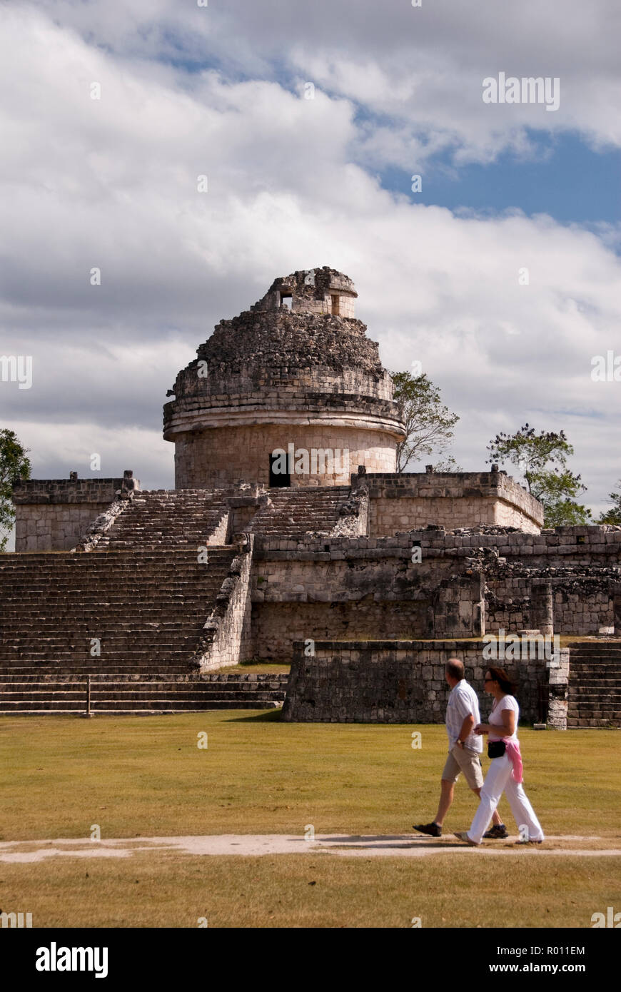 Tourists walk by El Caracol, a Mayan observatory for studying the night ...