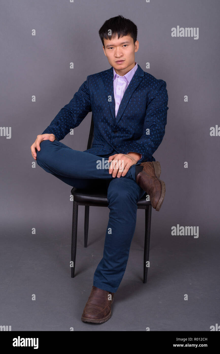 Man sitting chair suit full portrait hi-res stock photography and ...