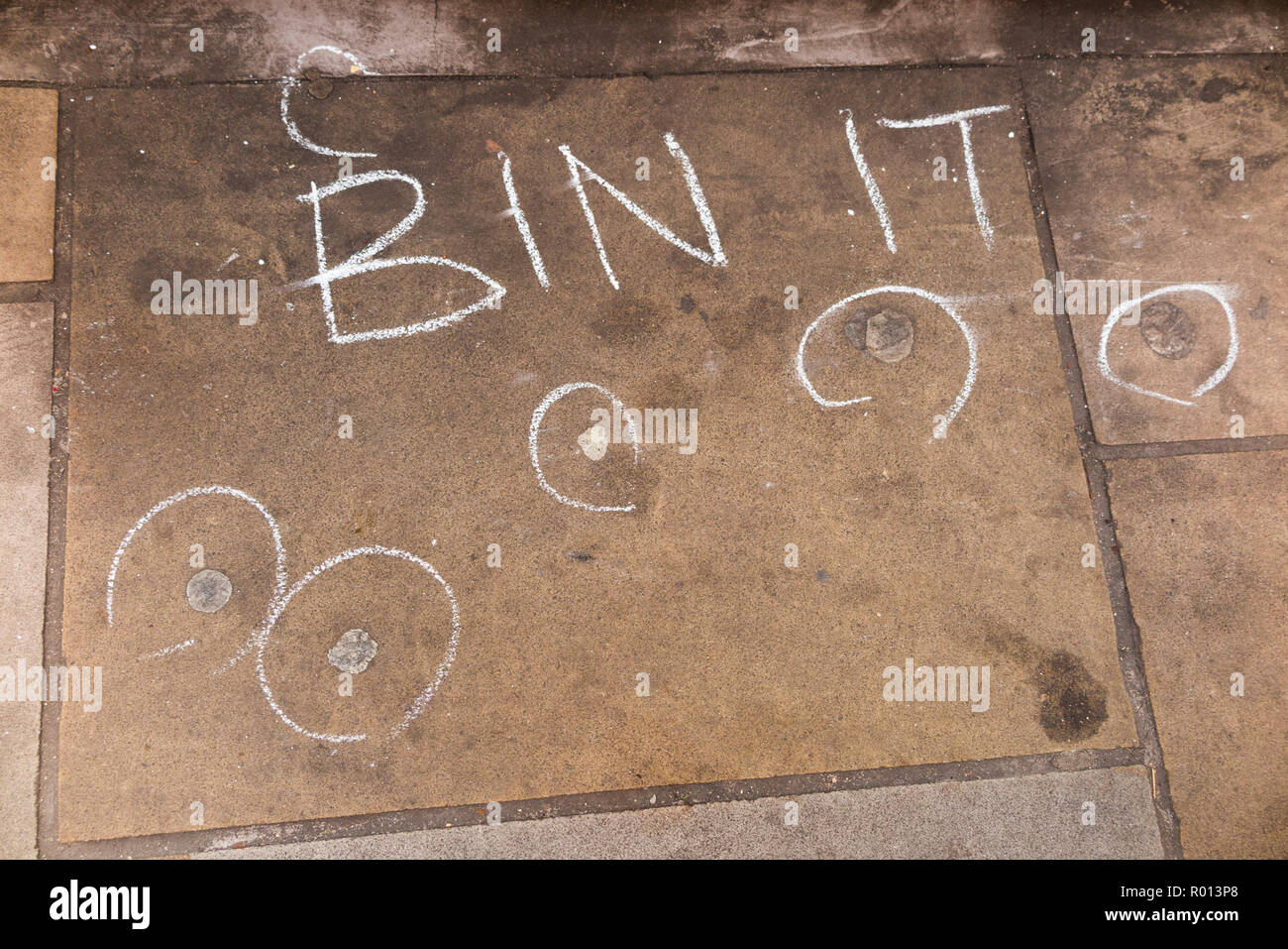 Chewing gum stuck on the pavement sidewalk in London, which has been ...