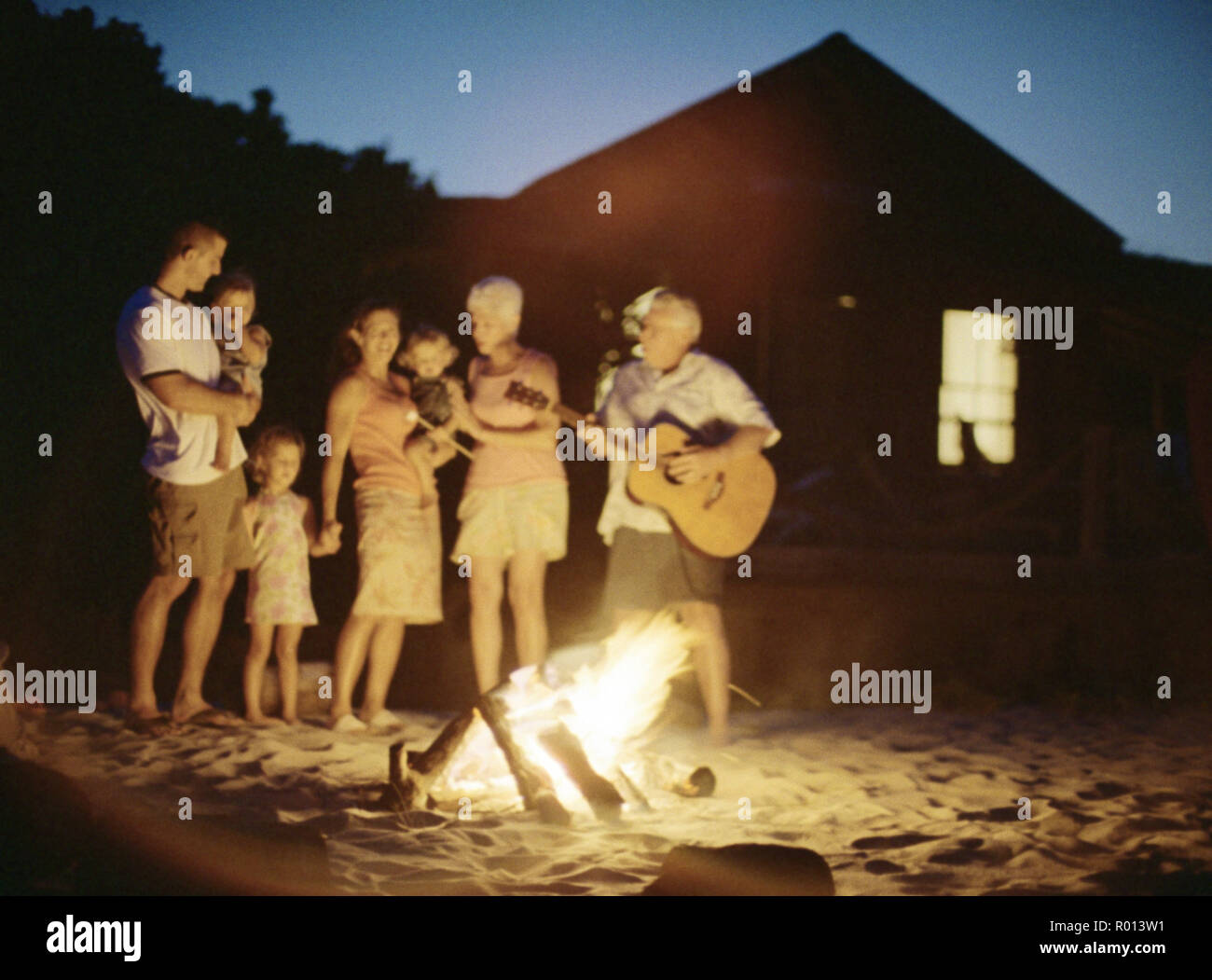 Beach bonfire with family Stock Photo - Alamy