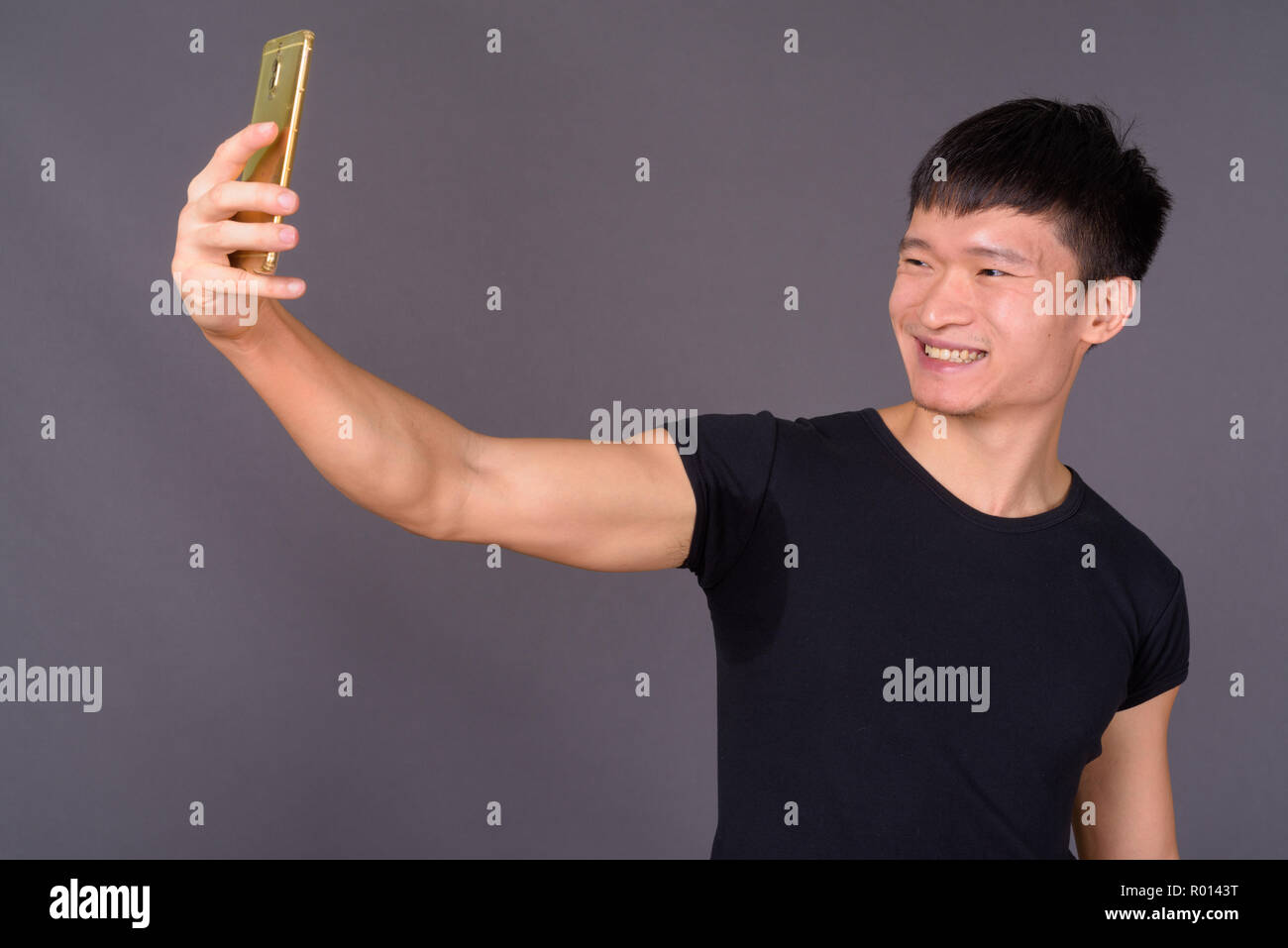 Smiling chinese man holding hi-res stock photography and images - Alamy