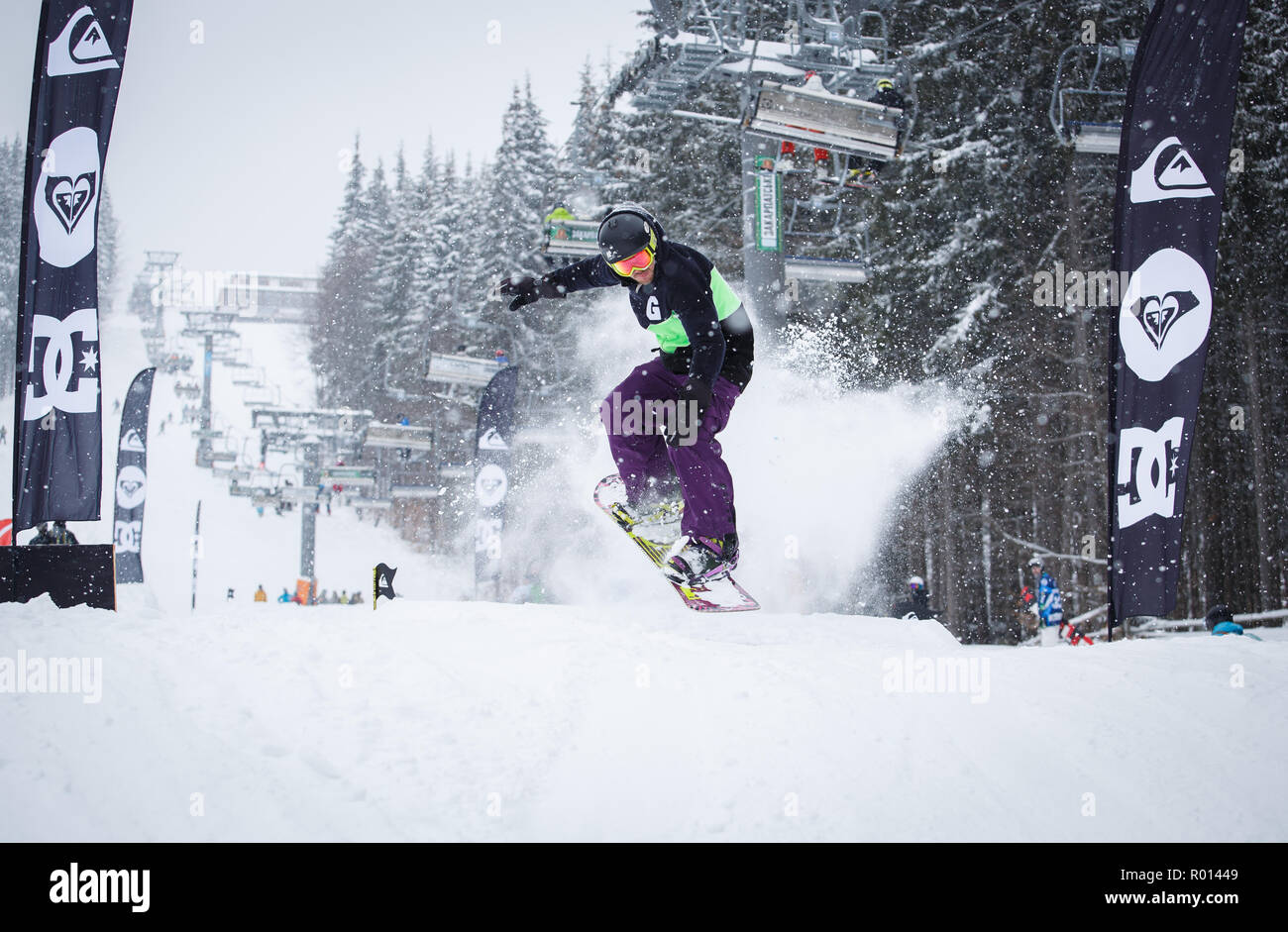 BUKOVEL,UKRAINE-20 MARCH,2018: Snowboard contest in winter park.Young ...