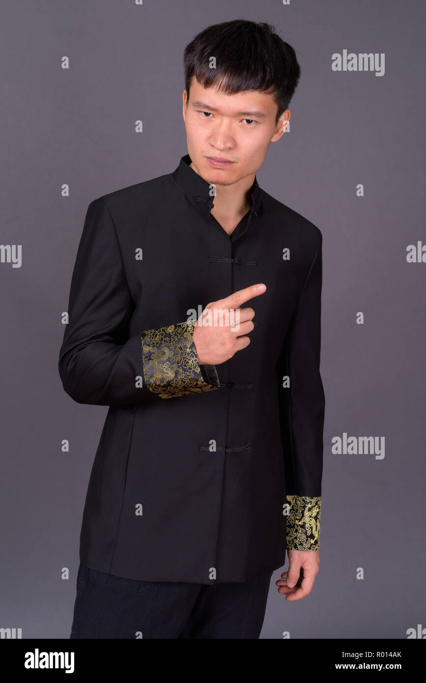 Young chinese man pointing hi-res stock photography and images - Alamy