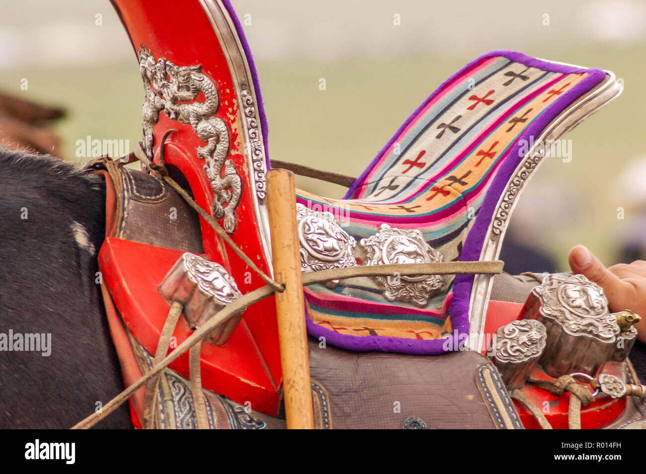 Closeup of colorful traditional Russian saddle with silver metal ...