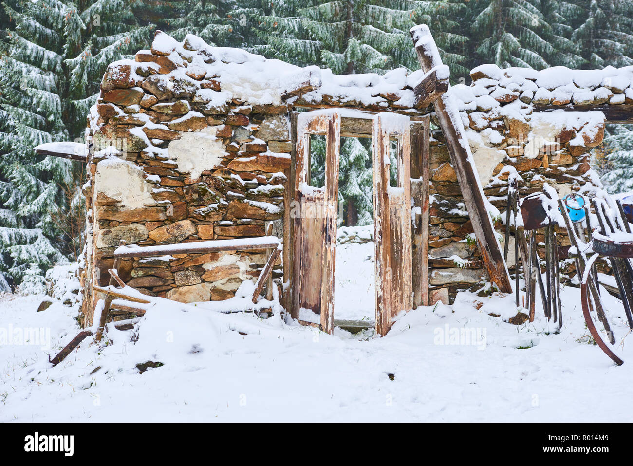 Old abandoned demolished house covered with snow in winter Stock Photo ...